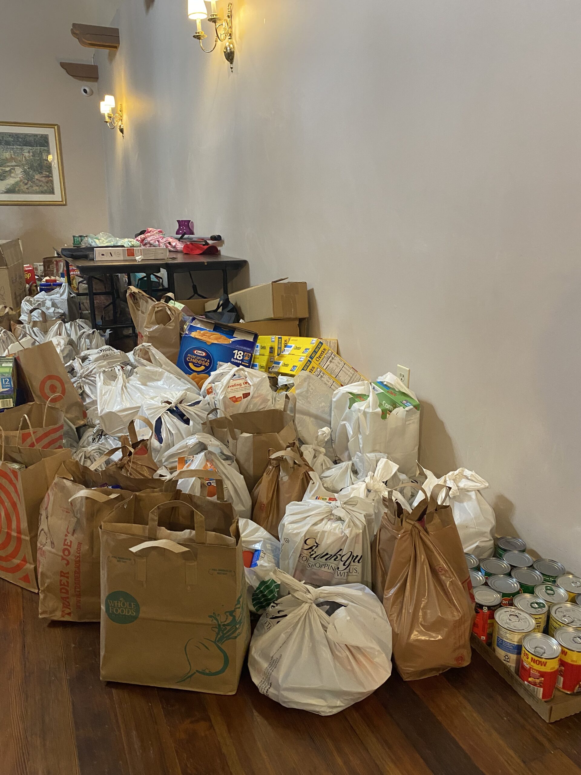Employees help restock the Volunteer Center food pantry – Torrance Refinery